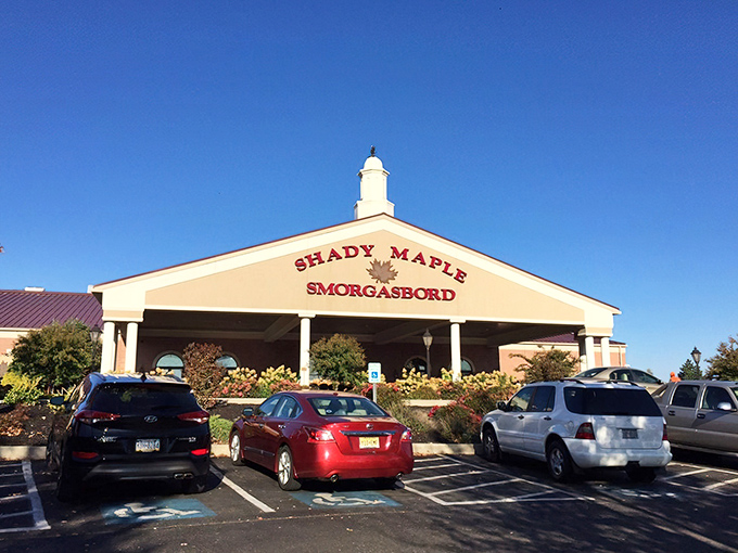 The grand entrance to Shady Maple stands like a temple to comfort food, complete with colorful landscaping that says "abandon your diet, all ye who enter here."