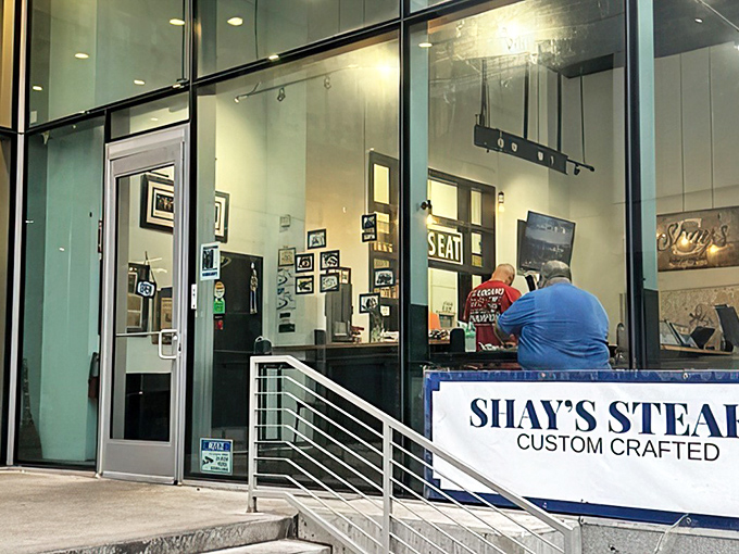The storefront beckons with that hypnotic blue neon glow&mdash;like a lighthouse guiding hungry sailors through Philadelphia's sandwich seas.