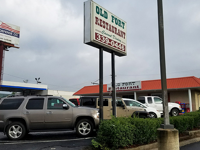 The classic roadside sign beckons like an old friend. No fancy neon needed when the promise of home cooking speaks this loudly.