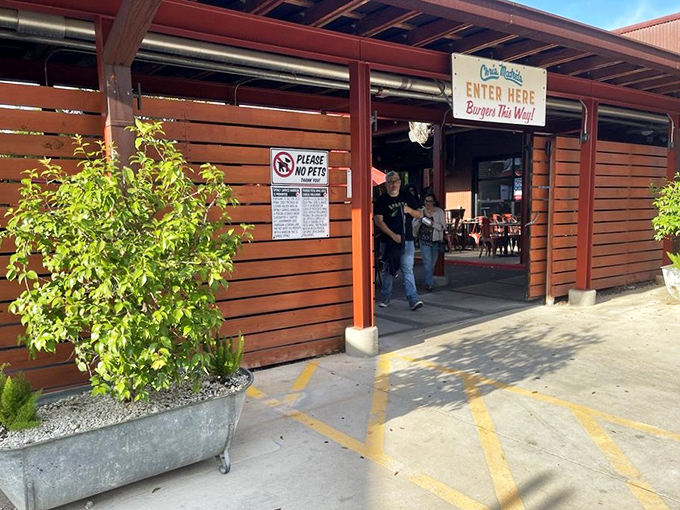The wooden exterior of Chris Madrid's welcomes you like an old friend who happens to make the best burgers in Texas.