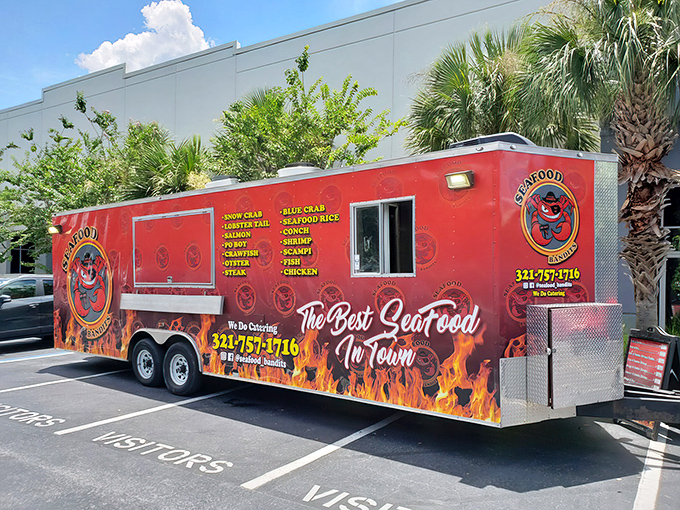 Parked beneath swaying palms, Seafood Bandits' vibrant truck stands out like a culinary beacon. Those flames on the side aren't just decoration&mdash;they're a warning that your taste buds are about to be set ablaze.