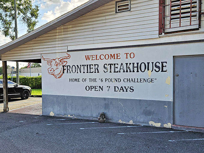 The iconic bull logo welcomes hungry travelers to Frontier Steakhouse, where the "6 Pound Challenge" has defeated many brave souls but created countless memories.