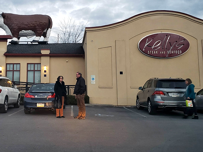 The iconic cow sculpture stands guard atop Kelly's, a bovine beacon guiding hungry travelers to this culinary oasis in Boalsburg.