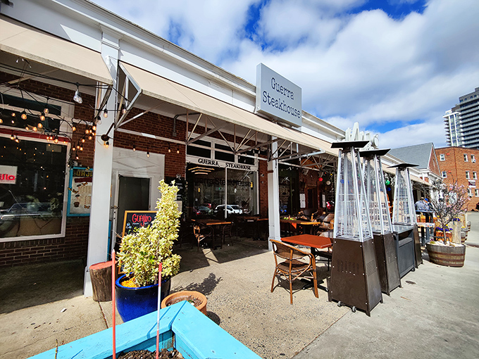 The unassuming exterior of Guerrera Steakhouse belies the culinary magic happening inside. String lights and outdoor heaters create an inviting atmosphere year-round.