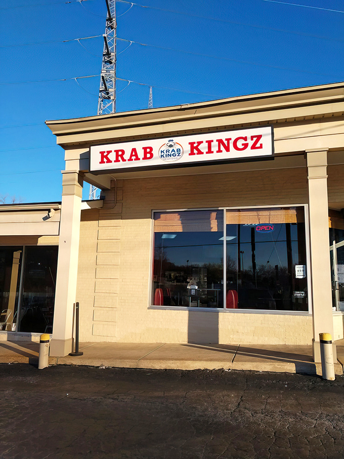 The bold red signage of Krab Kingz stands out against the blue Missouri sky, like a beacon calling all seafood lovers home.