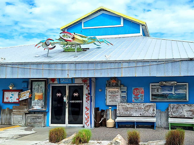 Colorful crustacean sculptures guard the entrance like quirky sentinels, announcing you've arrived at seafood paradise with Florida flair.