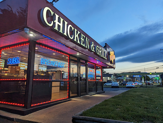 The iconic red awning of Legends Chicken & Waffles glows like a beacon of comfort food salvation against the twilight sky of Hyattsville.