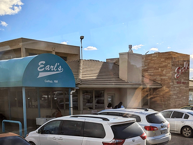 The distinctive turquoise awning and stone facade of Earl's stands out against Gallup's blue sky&mdash;a beacon for hash brown aficionados since 1947.