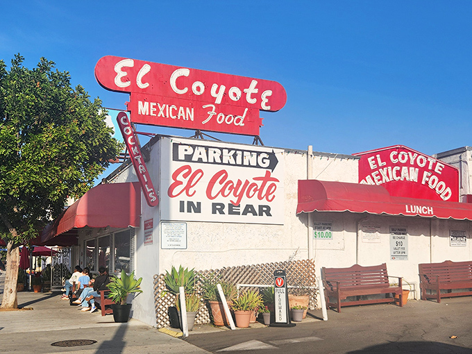 The iconic red and white sign of El Coyote has been beckoning hungry Angelenos for decades, promising Mexican comfort food and good times ahead.