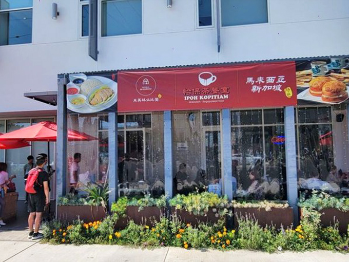 The bright red awning beckons like a culinary lighthouse in Alhambra, with photos of signature dishes that basically constitute edible billboards for your stomach.