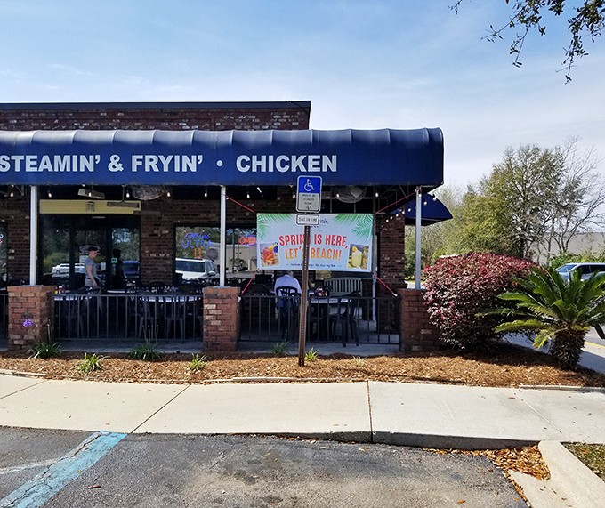 That blue awning isn't just decoration&mdash;it's a beacon calling you home to some seriously good Gulf Coast eating.