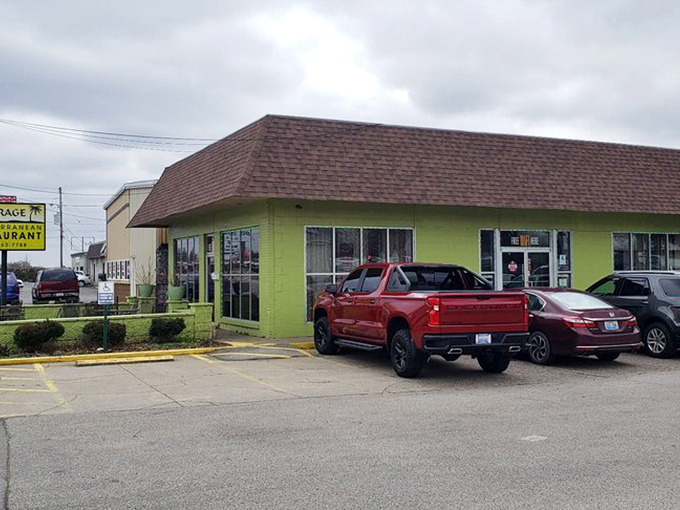 That cheerful green exterior isn't trying to blend in&mdash;it's announcing itself like a delicious beacon of Mediterranean hope.