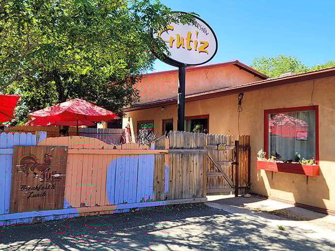 The unassuming salmon-colored adobe exterior of Gutiz hides culinary treasures like a pi&ntilde;ata conceals candy. Those red umbrellas promise shade for sun-drenched diners.