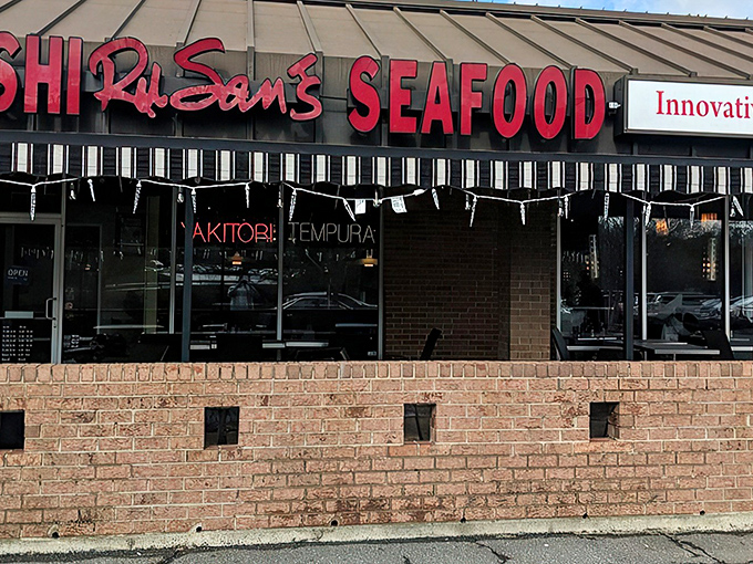 The bold red signage of Ru San's stands out like a beacon for sushi lovers, promising seafood treasures within those brick walls.