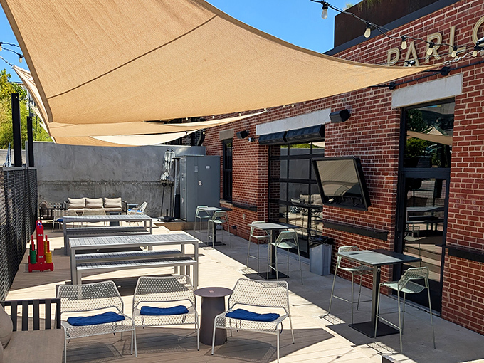 Parlor OKC's brick facade with rooftop seating says "I'm cool without trying too hard" &ndash; industrial chic meets Oklahoma hospitality.