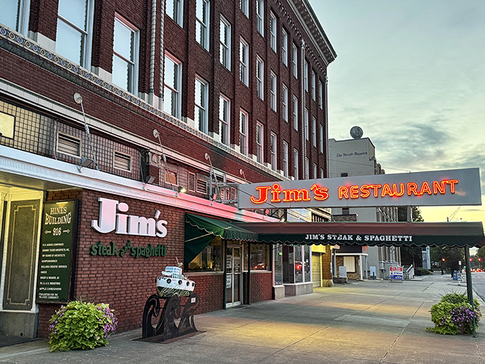 As dusk settles over 5th Avenue, Jim's neon glow promises comfort food that transcends generations of West Virginia diners.