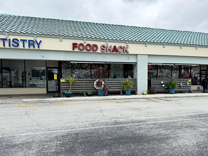 The unassuming strip mall exterior hides culinary treasures within. That sticker-covered window? It's the Florida foodie equivalent of a passport stamp collection.