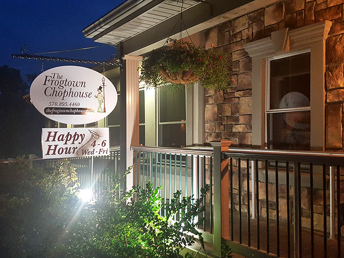 The stone facade glows with warm invitation at twilight, like a culinary lighthouse beckoning hungry travelers through the Pocono darkness.