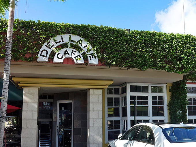 The iconic ivy-draped entrance to Deli Lane Cafe beckons like a green oasis in South Miami's urban landscape. Breakfast paradise awaits behind those doors.