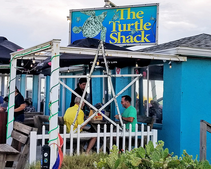 Locals gather on the patio, proving that the best seafood joints don't need fancy facades&mdash;just fresh catches and cold drinks.