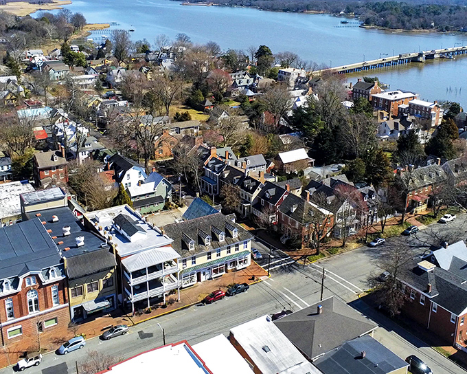 The same aerial view showing Chestertown's perfect blend of colonial architecture and natural beauty. Those trees aren't just pretty &ndash; they're providing shade for centuries of stories.