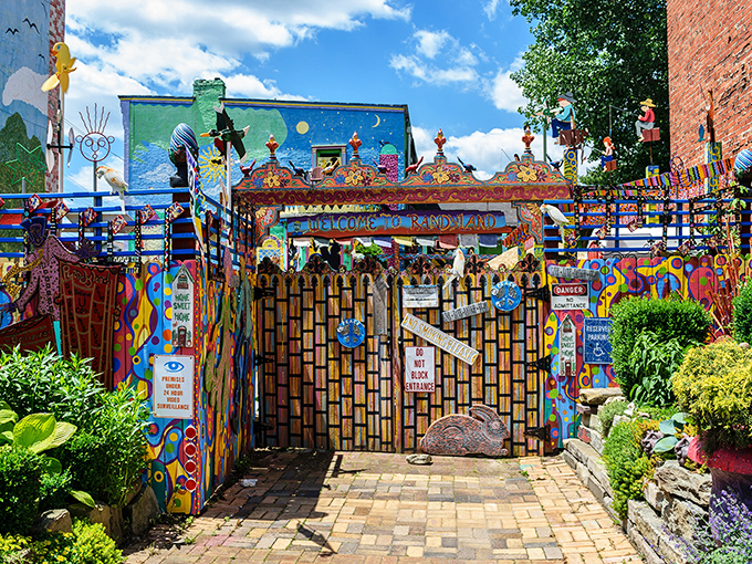 The entrance gate stands like a portal to another dimension where the rules of conventional design have been gleefully abandoned.
