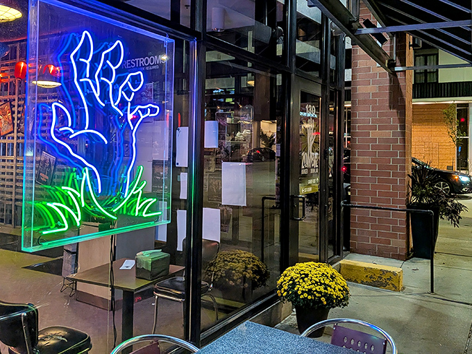 That neon zombie hand in the window isn't just decoration&mdash;it's beckoning you toward burger nirvana. Resistance is futile, and delicious.