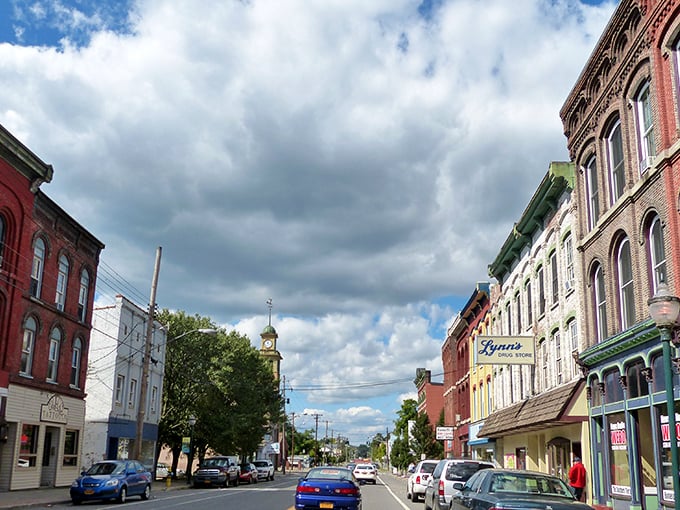 Downtown Owego's historic architecture stands like a time capsule under dramatic skies, where brick facades tell stories older than most Hollywood marriages.