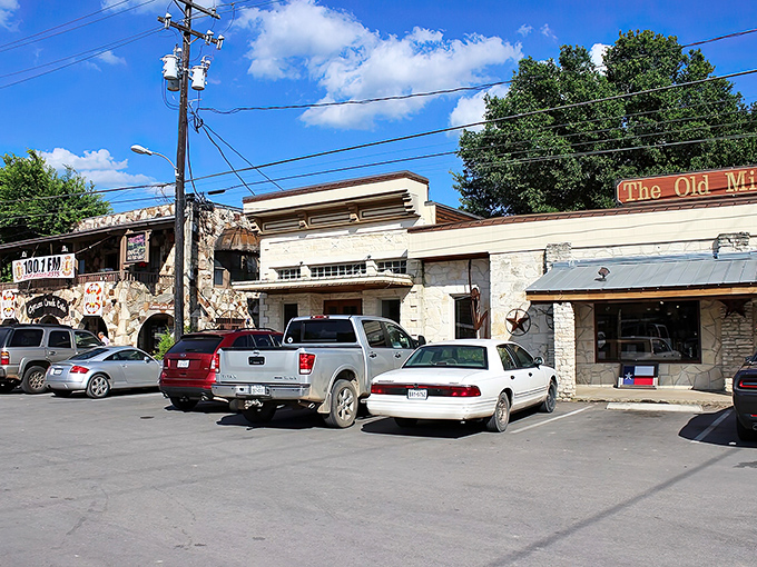 The Old Mill area showcases Wimberley's limestone charm, where pickup trucks and history coexist in perfect Hill Country harmony.