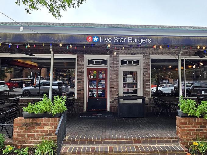 The welcoming entrance adorned with colorful lights promises the kind of burger experience that makes detours worthwhile.