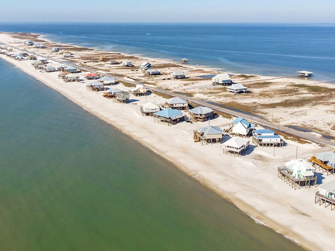 Aerial paradise where land meets two shades of blue. Dauphin Island's slender profile showcases its perfect balance of beachfront homes and untouched shoreline.
