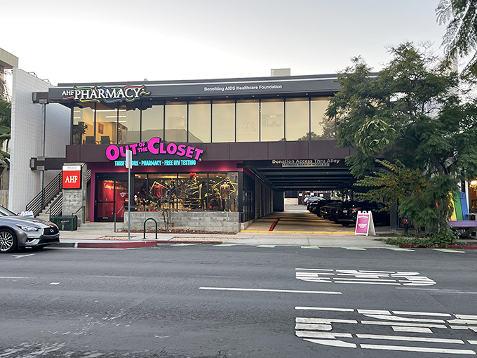 The hot pink signage of Out of the Closet beckons like a neon promise of retail adventure in San Diego's urban landscape.