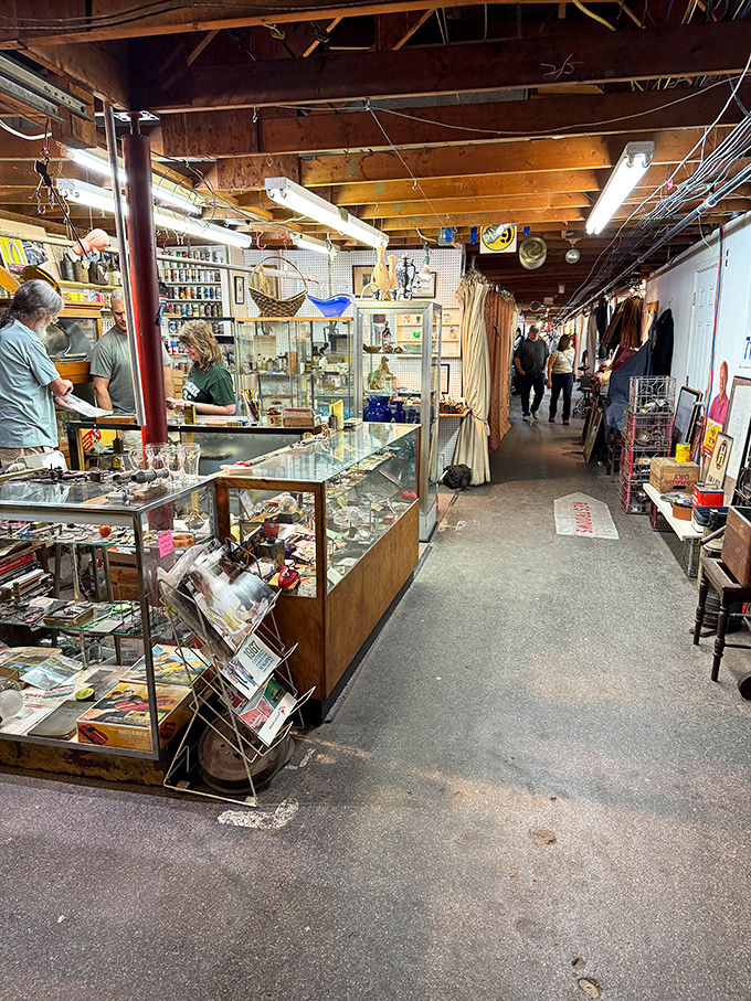 The indoor market's narrow pathways create a treasure map where X marks the spot at every turn and glass cases guard vintage gold.