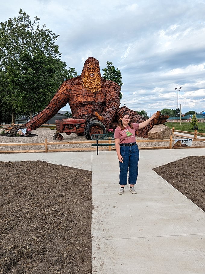Mom, can we keep him? Nelson has become Celina's unofficial greeter, welcoming visitors with his permanent wooden smile and impressive stature.