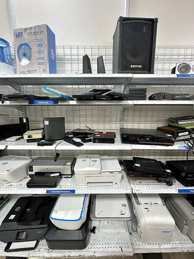 Printers and speakers line up like tech refugees seeking second chances in new homes with yours.