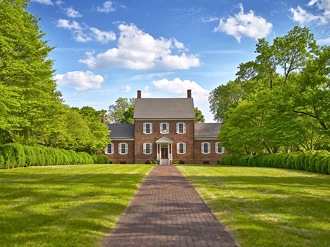 Ayr Mount stands proudly amid manicured grounds, its brick fa&ccedil;ade and symmetrical windows embodying the architectural elegance of a bygone era.