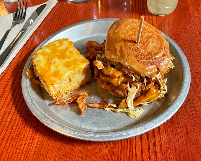Melty cheese, tangy slaw, and tender chicken on a toasted bun&mdash;proof that sometimes the best relationships are the messiest ones. 