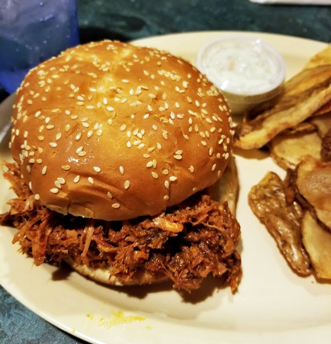 A BBQ sandwich that requires both hands and several napkins. The sesame-studded bun barely containing its smoky treasure.