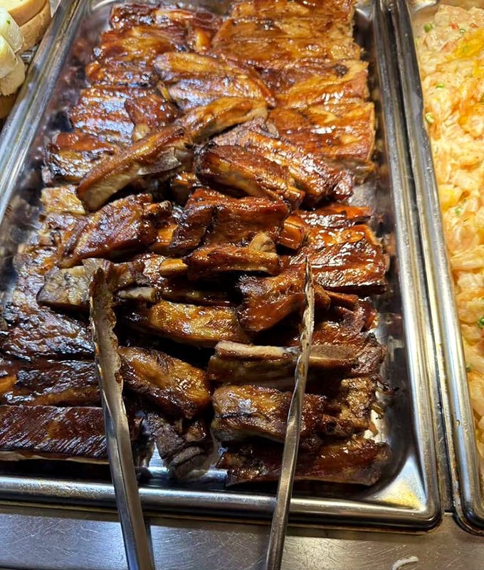 BBQ ribs glistening with sauce like they just stepped out of a food commercial. These sticky, sweet meat candy strips won't last long.