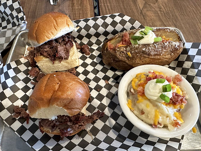 BBQ sliders that prove good things come in small packages, flanked by sides that deserve their own spotlight on this metal tray of joy.