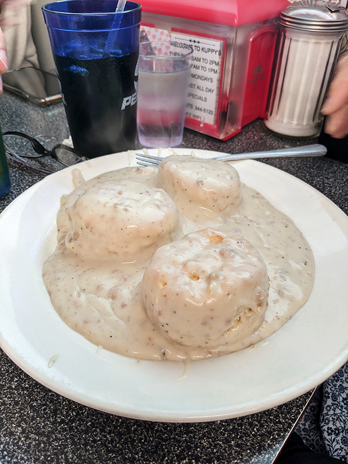Biscuits and gravy&mdash;the breakfast that hugs you from the inside. Kuppy's version is the comfort food equivalent of finding money in an old jacket pocket.