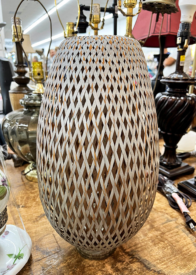 This intricately woven lamp shade transforms ordinary light into a patterned dance of shadows &ndash; someone's discarded d&eacute;cor becoming another's statement piece.