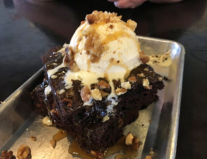 A brownie that's clearly been hanging out with the brisket, topped with ice cream that's melting faster than your diet resolutions. Resistance is futile.