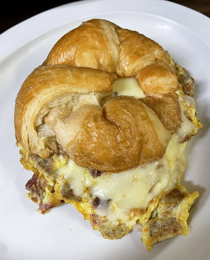 The humble croissant transformed into breakfast royalty&mdash;golden, flaky, and stuffed with melty cheese and eggs. Morning commutes were invented for sandwiches like this.