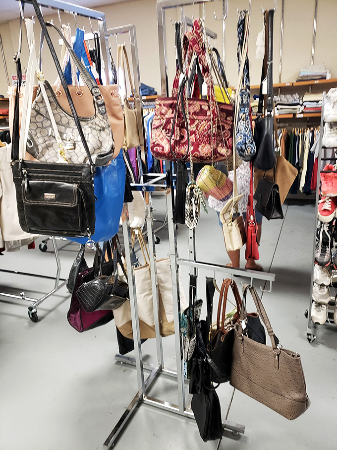 Handbag heaven! Designer lookalikes and genuine finds hanging like fashionable fruit ready for picking. That red paisley tote is practically begging to go home with someone.