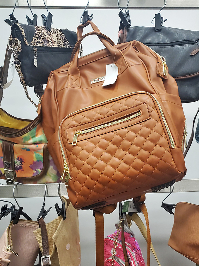That caramel-colored quilted backpack still has its tags—proof that thrifting sometimes means finding brand new items at a fraction of retail prices.