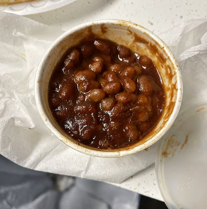 Baked beans swimming in a molasses-rich sauce. These aren't your campfire beans&mdash;they've graduated to gourmet territory with smoky depth.