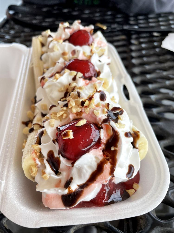 This banana split isn't just dessert &ndash; it's edible nostalgia, a sweet reminder of simpler times when happiness came in a boat-shaped container.