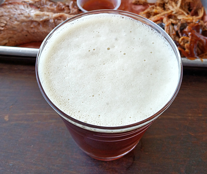 Nothing complements the primal pleasure of barbecue quite like an amber beer with just the right amount of foam-capped promise.