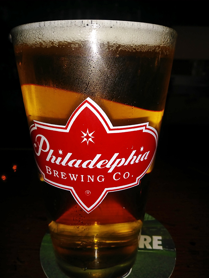 A perfectly poured pint of Philadelphia Brewing Co. beer&mdash;where the foam-to-liquid ratio suggests someone behind the bar actually cares about your happiness.